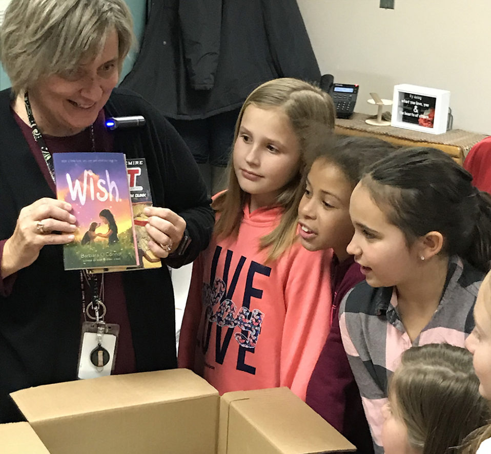 Students dive into new books provided through Give-a-Gift fundraiser ...